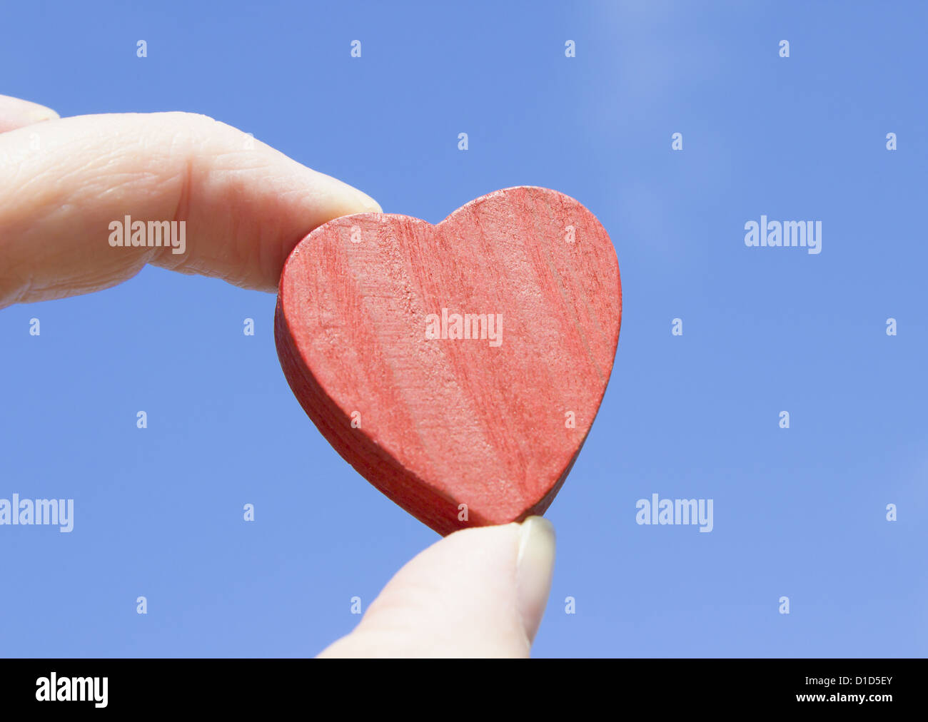 Hand holding a heart Stock Photo - Alamy