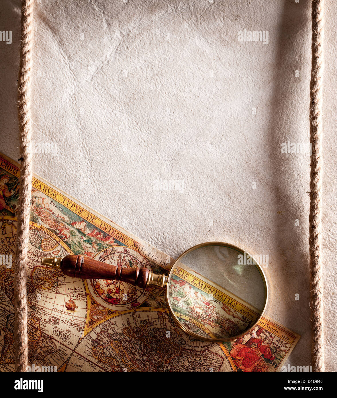 Magnifying glass on old parchment Stock Photo - Alamy