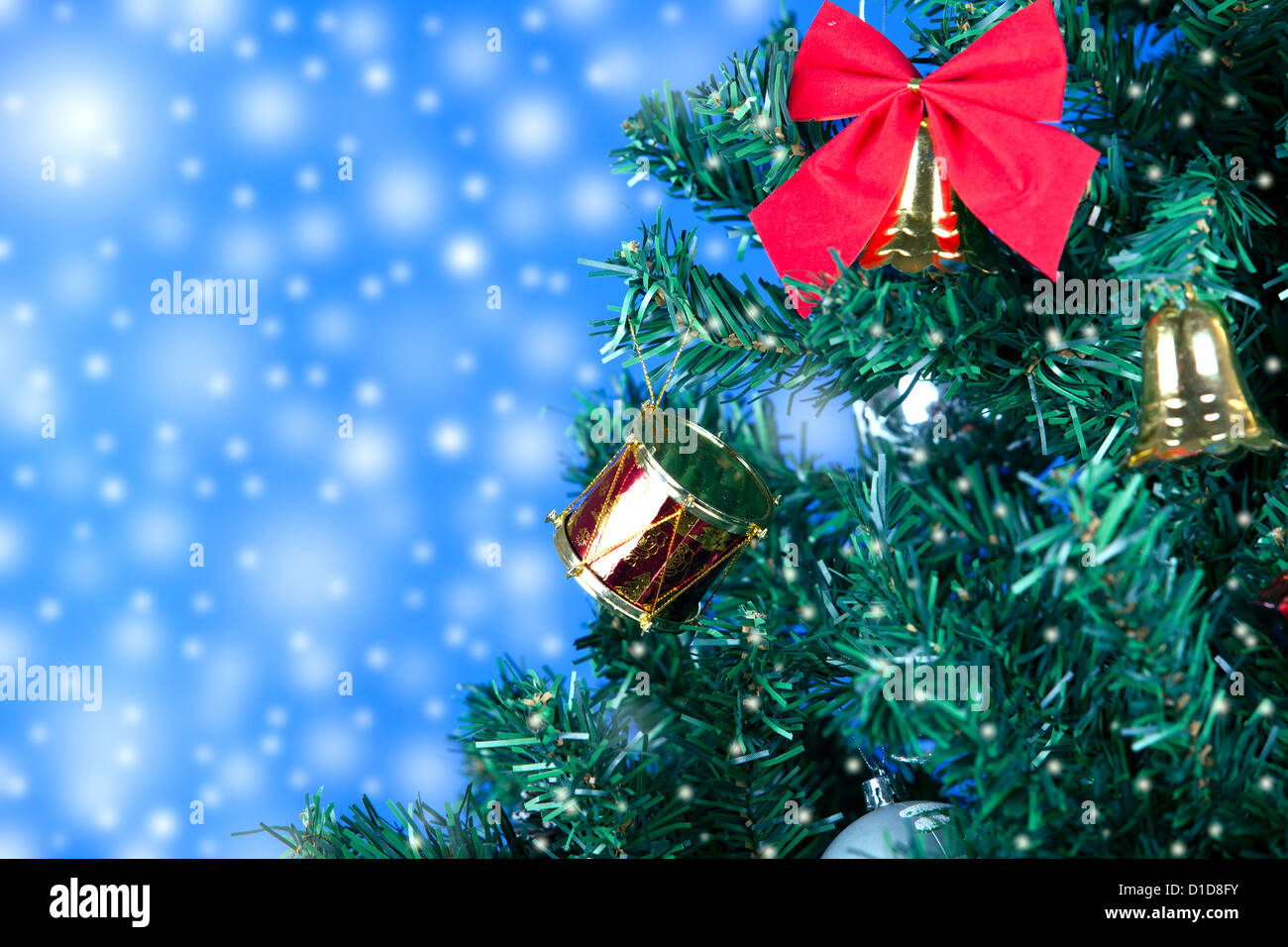 a close up christmas toys on a tree snowing Stock Photo - Alamy