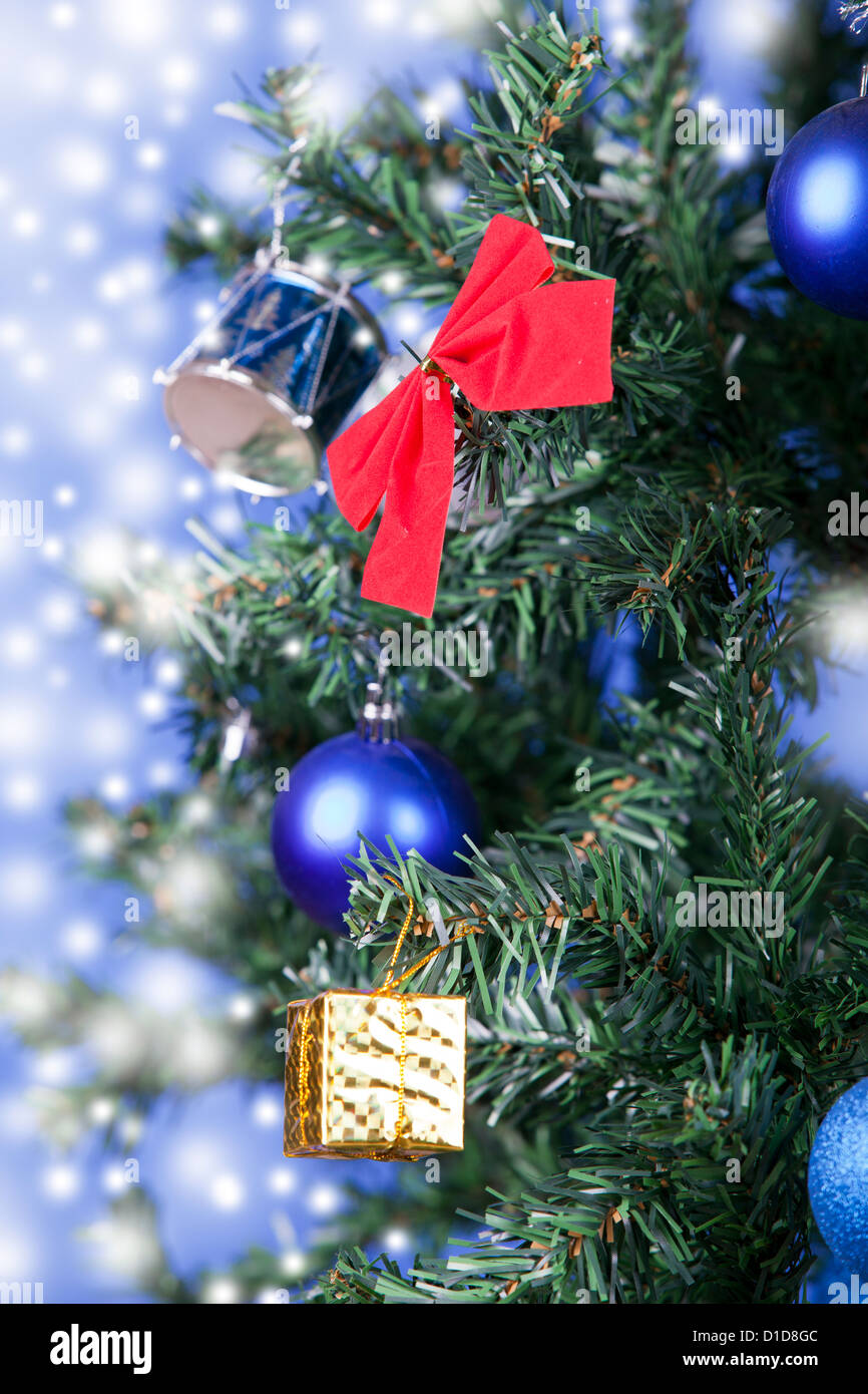 a close up christmas toys on a tree snowing Stock Photo - Alamy