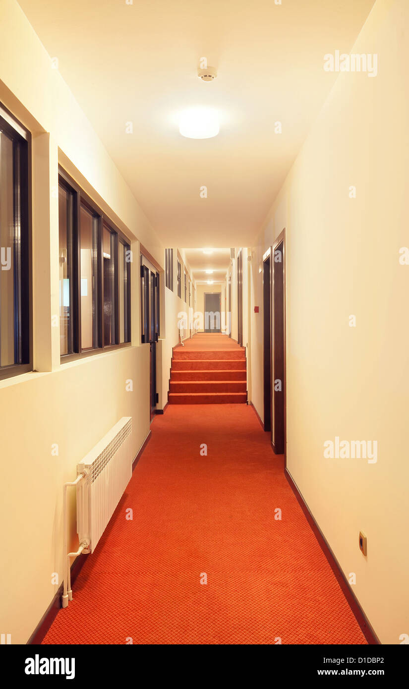 Interior of a hotel, view on hall, empty and long Stock Photo - Alamy