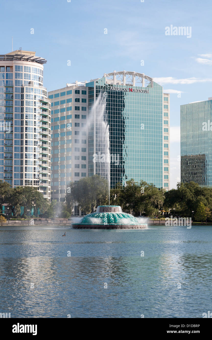 Modern high-rise buildings behind fountain in Lake Eola in downtown ...