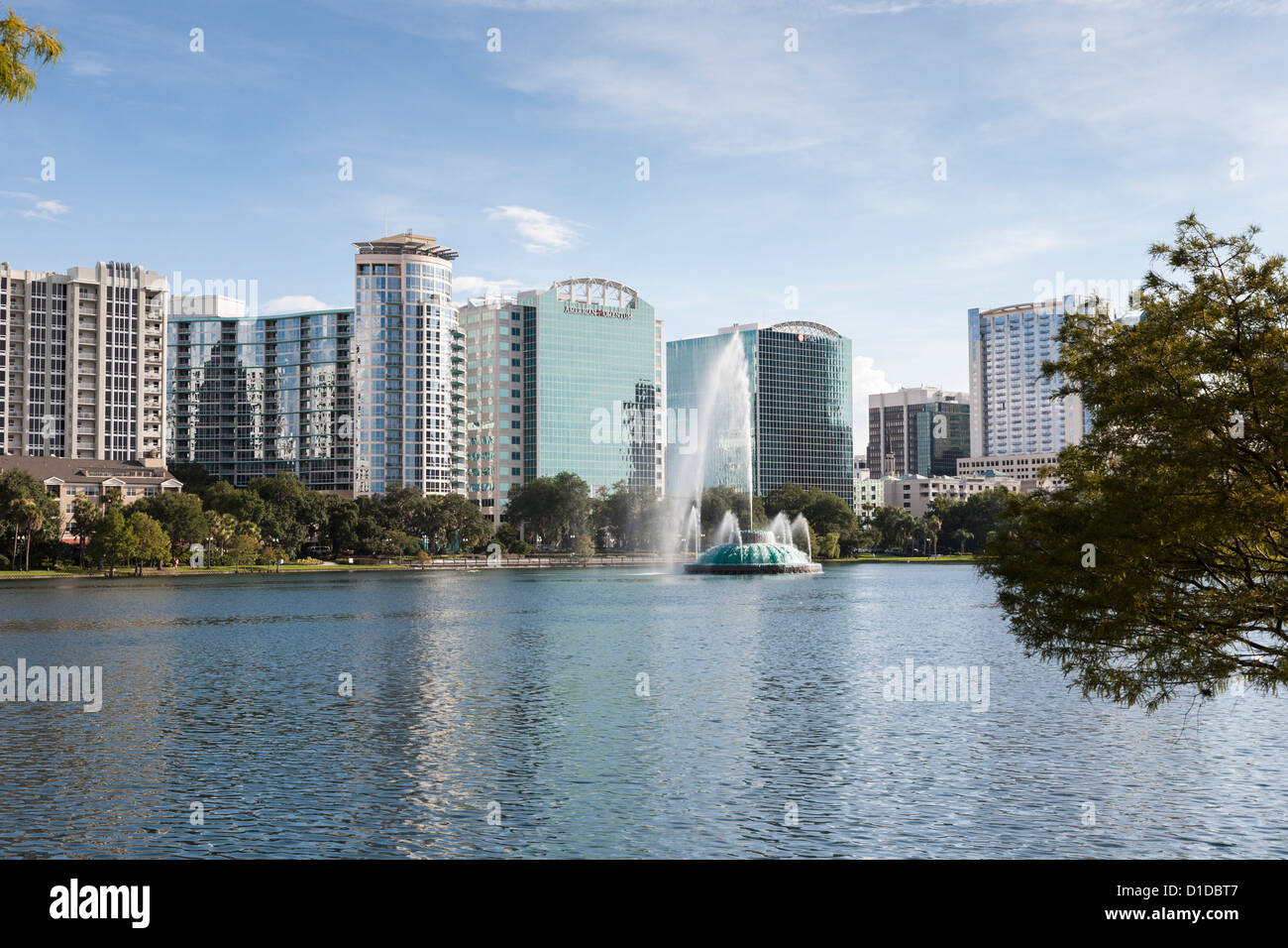Modern high-rise buildings behind fountain in Lake Eola in downtown ...