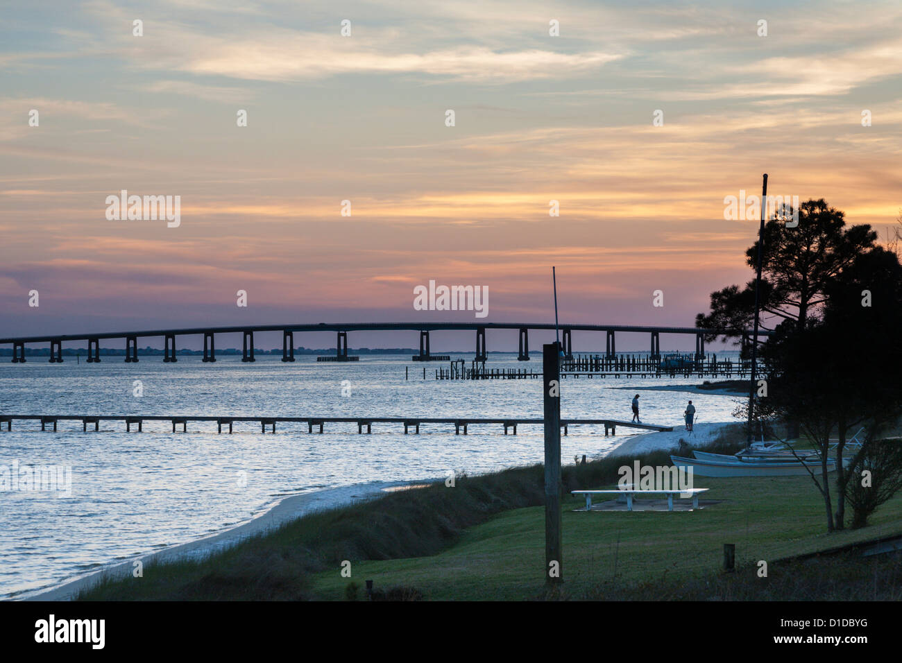 Fishing pier and highway bridge over Santa Rosa Sound during sunset at ...