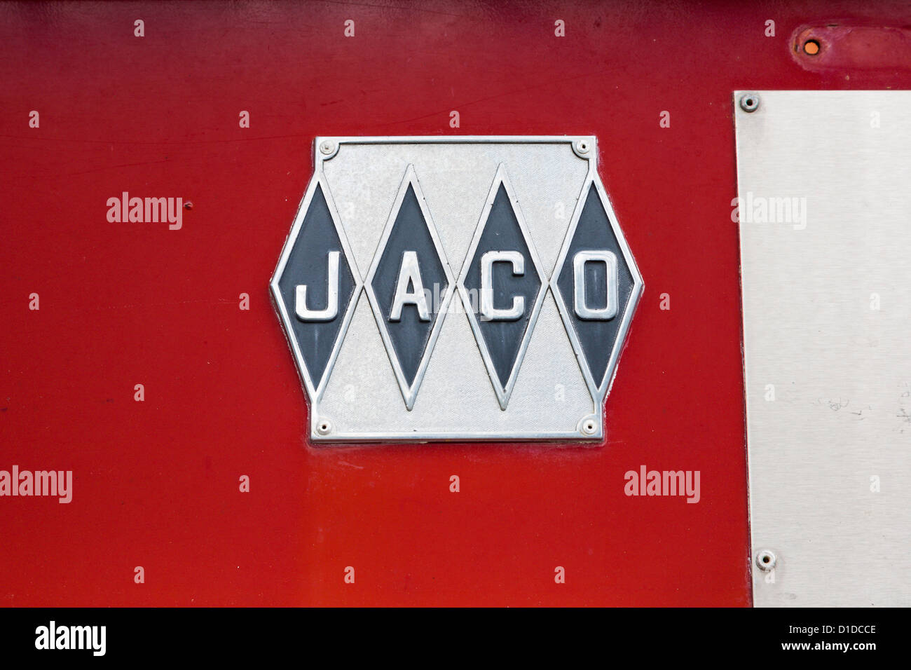 Close-up detail of JACO logo name plate on antique red Ford 900 JACO ...