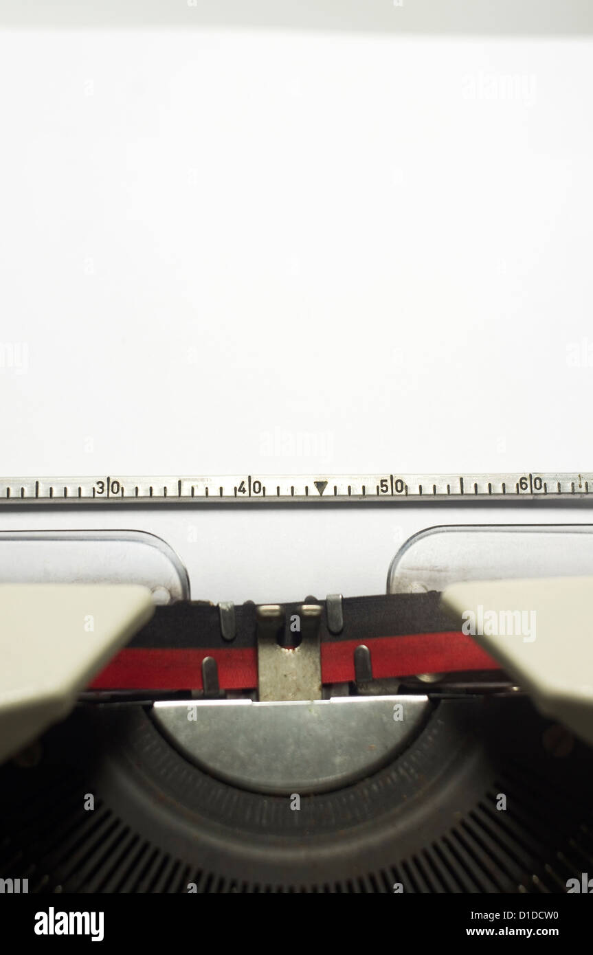 a close up of typewriter, focus on paper where message will be typed ...