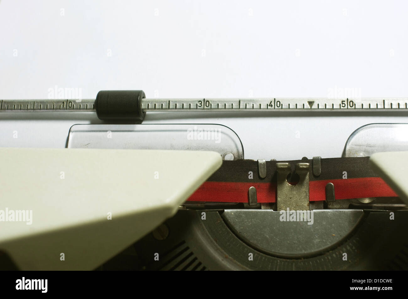 a close up of typewriter, focus on paper where message will be typed ...