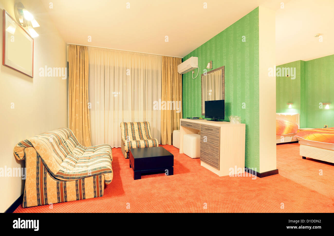 Interior of a hotel apartment, room with green wallpapers Stock Photo ...