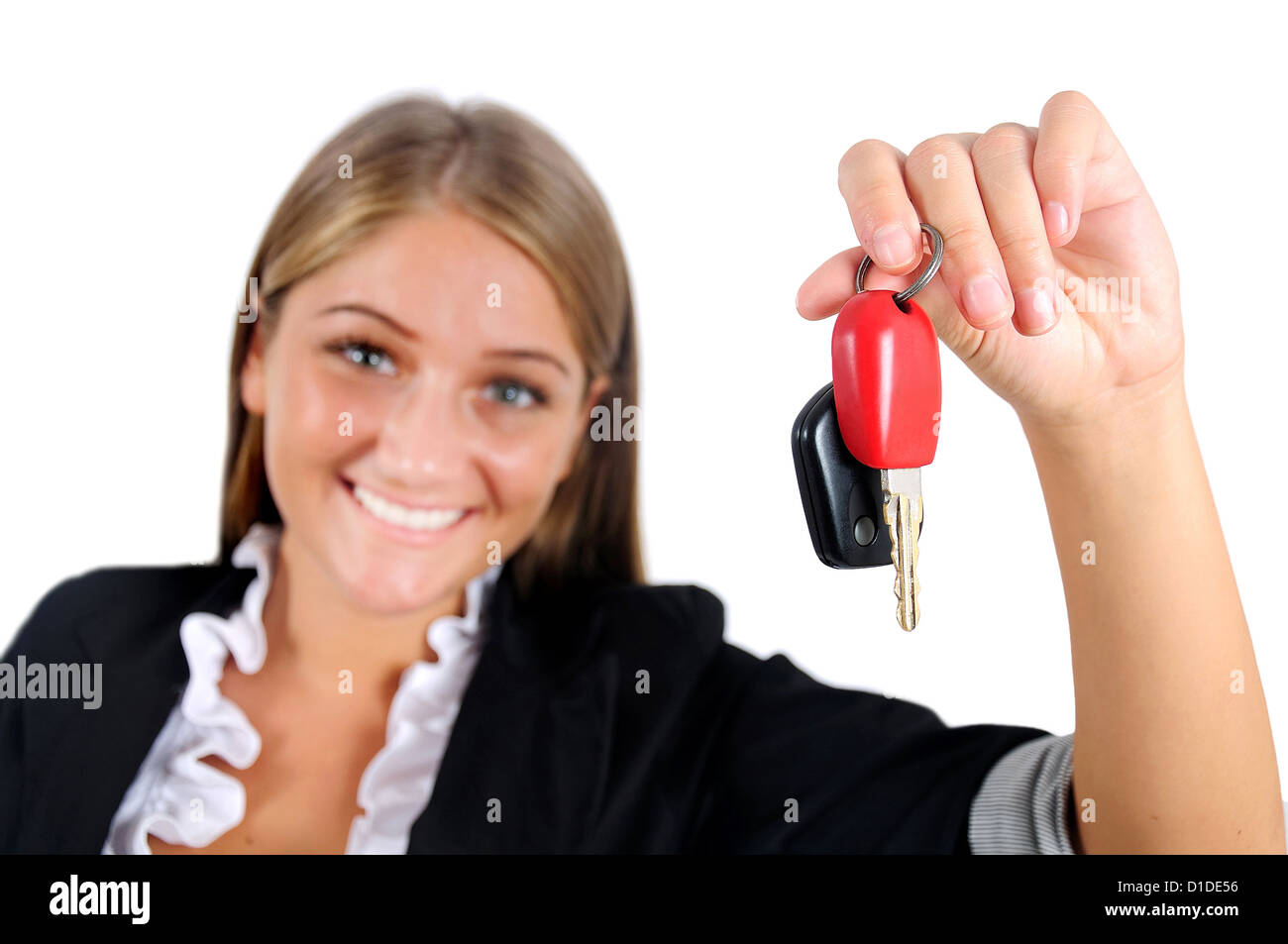 Isolated young business woman showing car key Stock Photo - Alamy