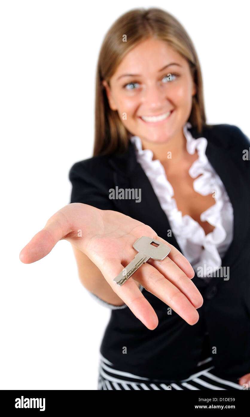 Isolated young business woman giving key Stock Photo - Alamy