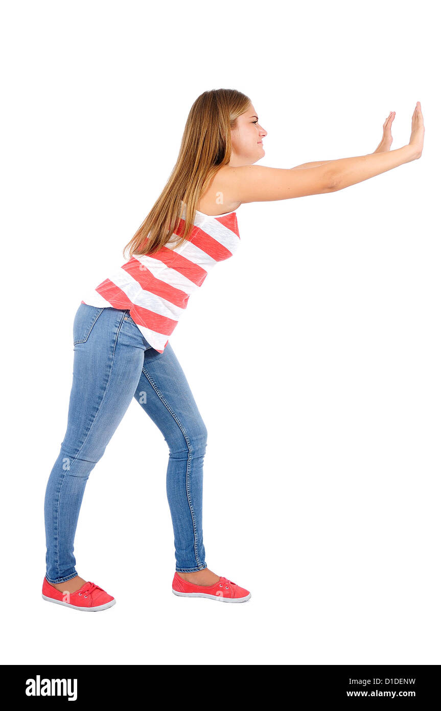 Isolated young casual woman push something Stock Photo - Alamy