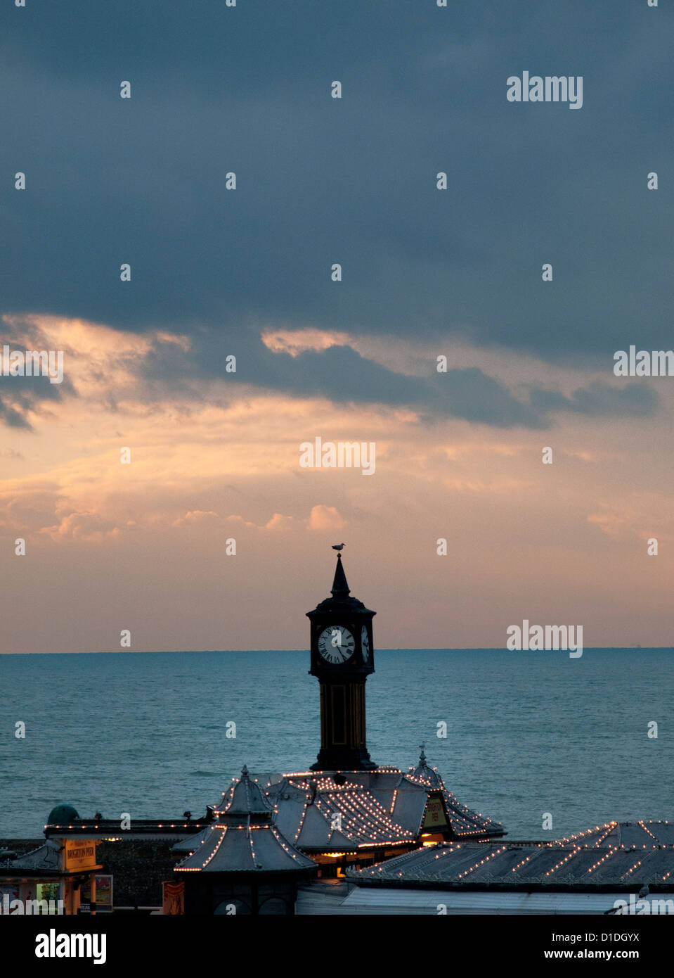Brighton Pier as the sun goes down Stock Photo - Alamy