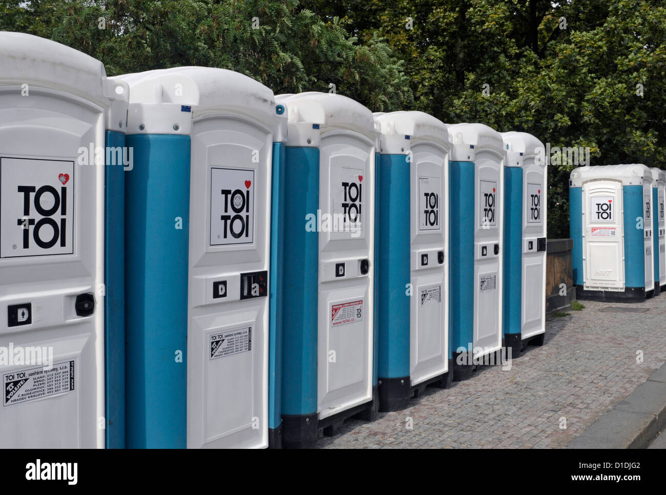 Portable toilets lined up in a row Stock Photo - Alamy