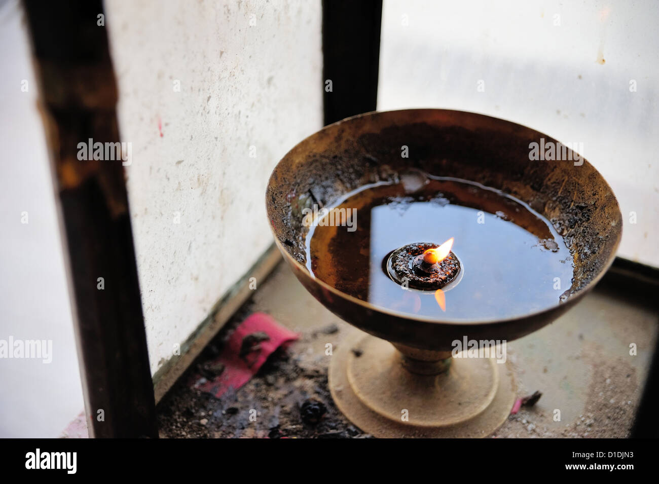 You can saw this in Chinese Temple. Burning oil candle notice the god ...