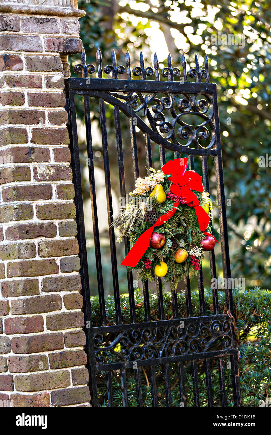 Christmas wreath on an iron gate of a historic home in Charleston ...