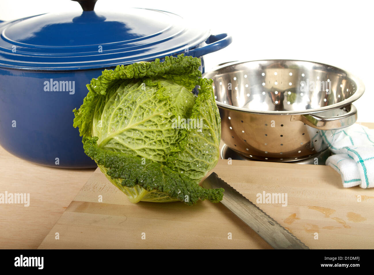 Fresh Savoy Cabbage on a cutting board in a kitchen Stock Photo - Alamy