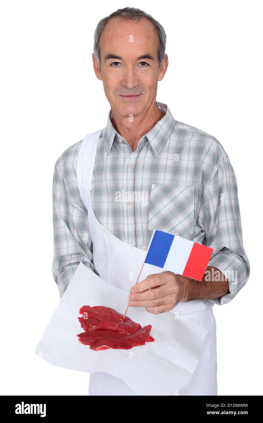 Butcher with French steak Stock Photo - Alamy