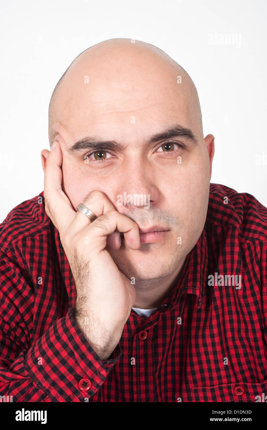 Portrait of a serious young adult bald man Stock Photo - Alamy