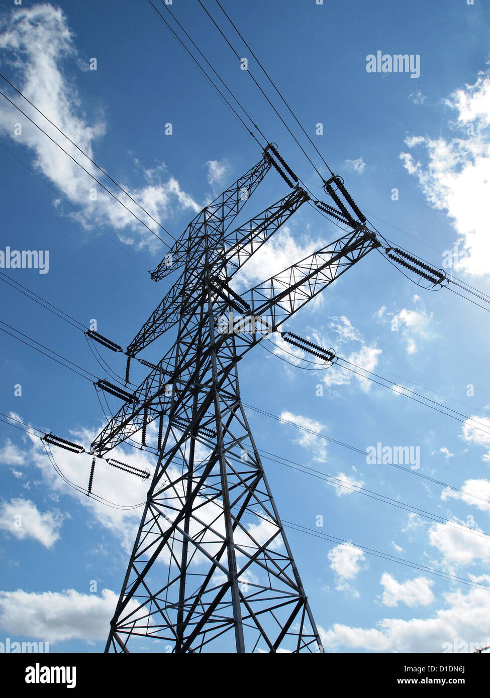 Electric power lines run through a pylon Stock Photo - Alamy