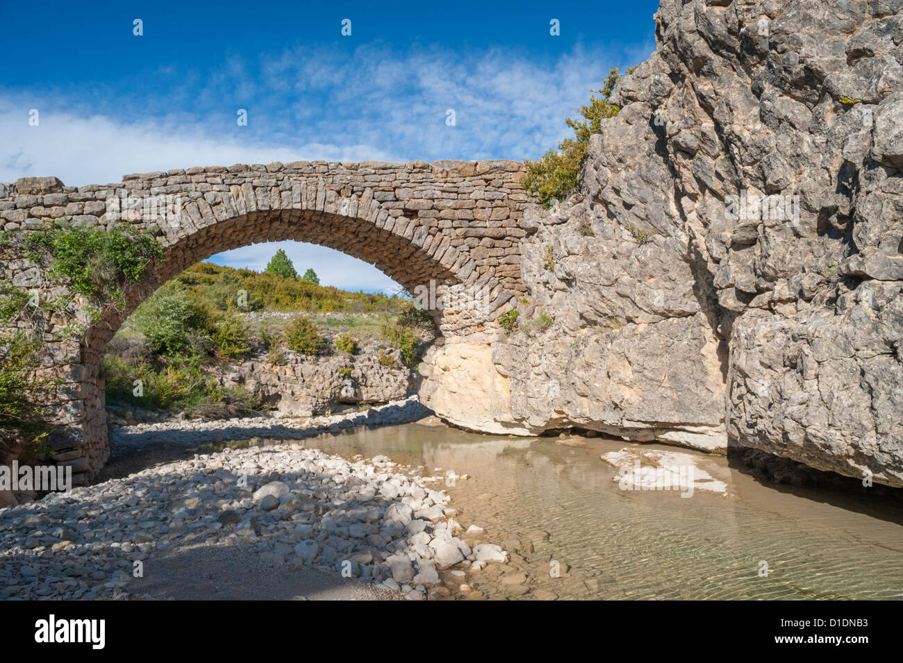 Arched limestone bridge near the village of Sarsa de Surta, Sierra y ...
