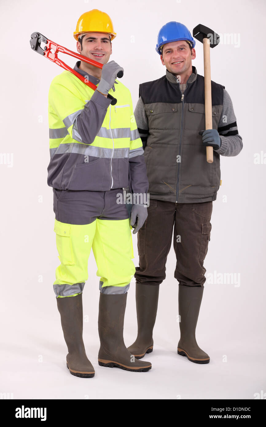 Two builder stood next to each other Stock Photo - Alamy