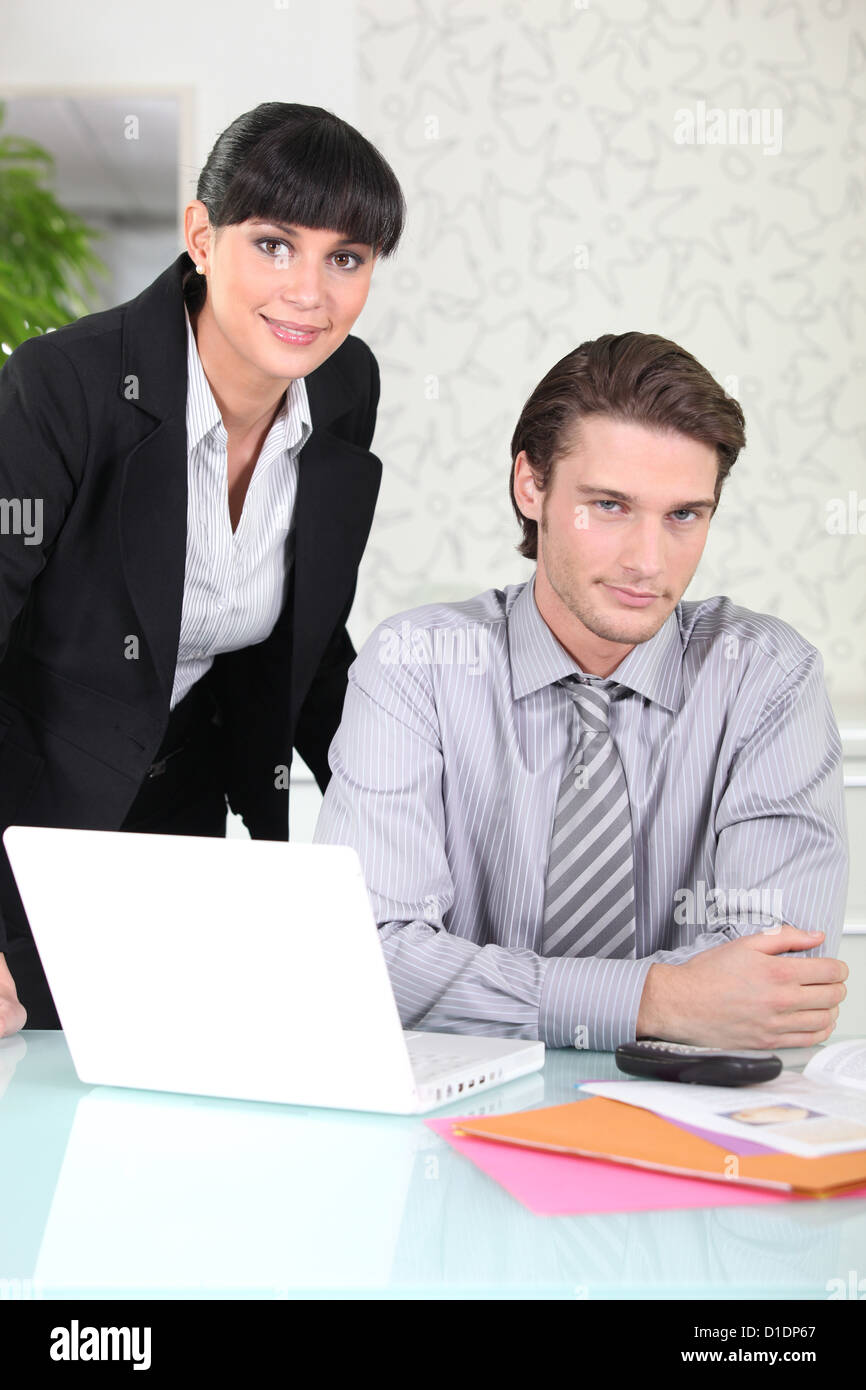 Colleagues working together Stock Photo - Alamy