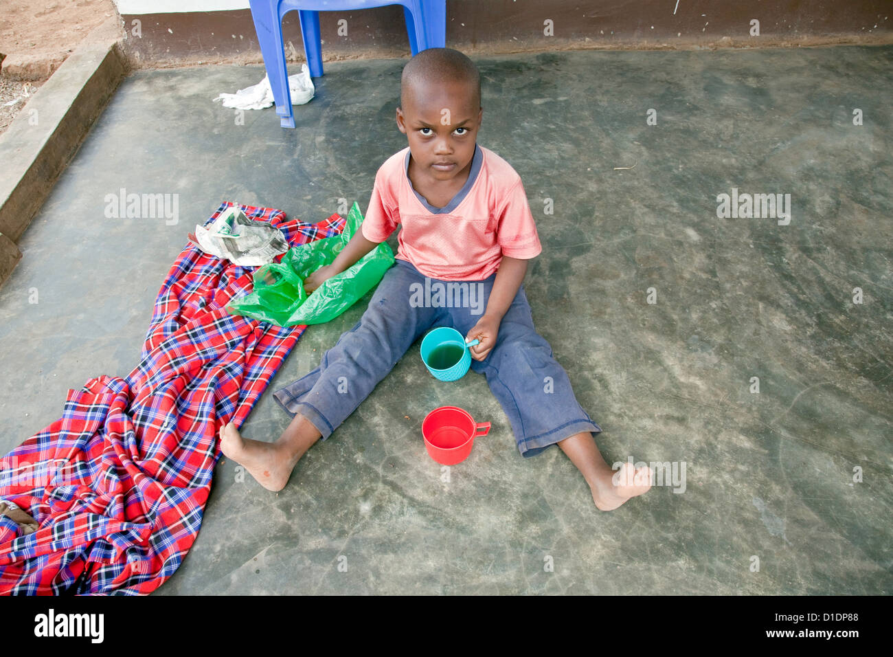 Small Africa Boy playing outside his house in Africa;Children in ...