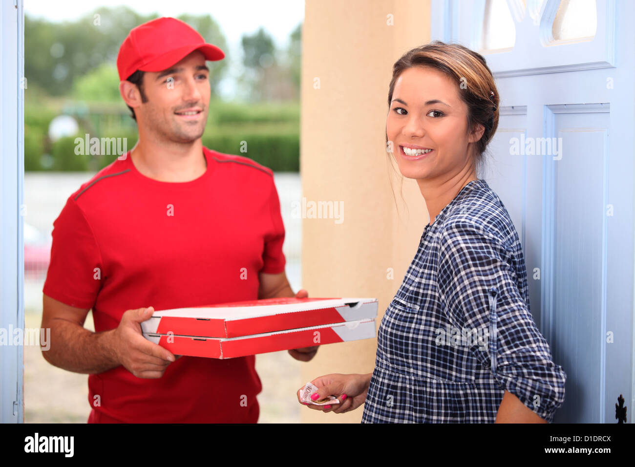 young man delivering pizza Stock Photo - Alamy