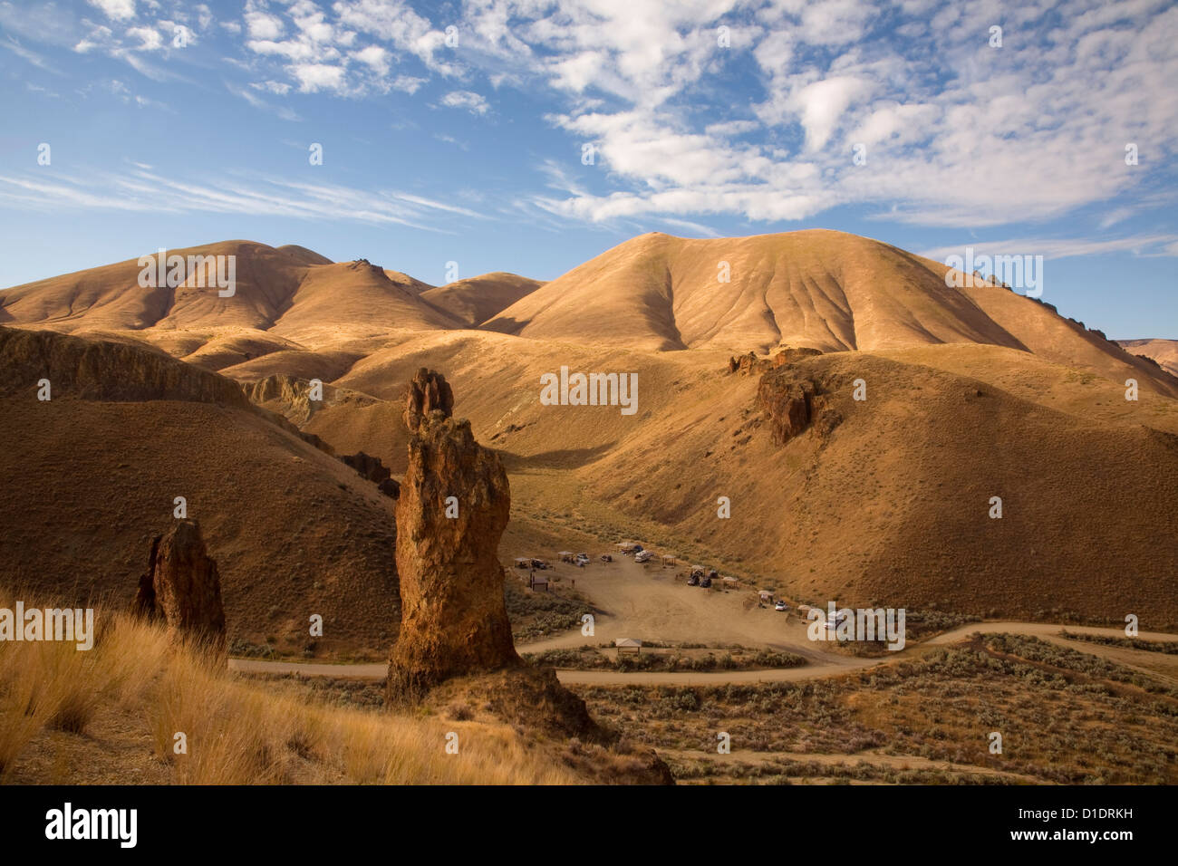 Spires of weathered volcanic tuff on the steep,dry, hilliside above ...