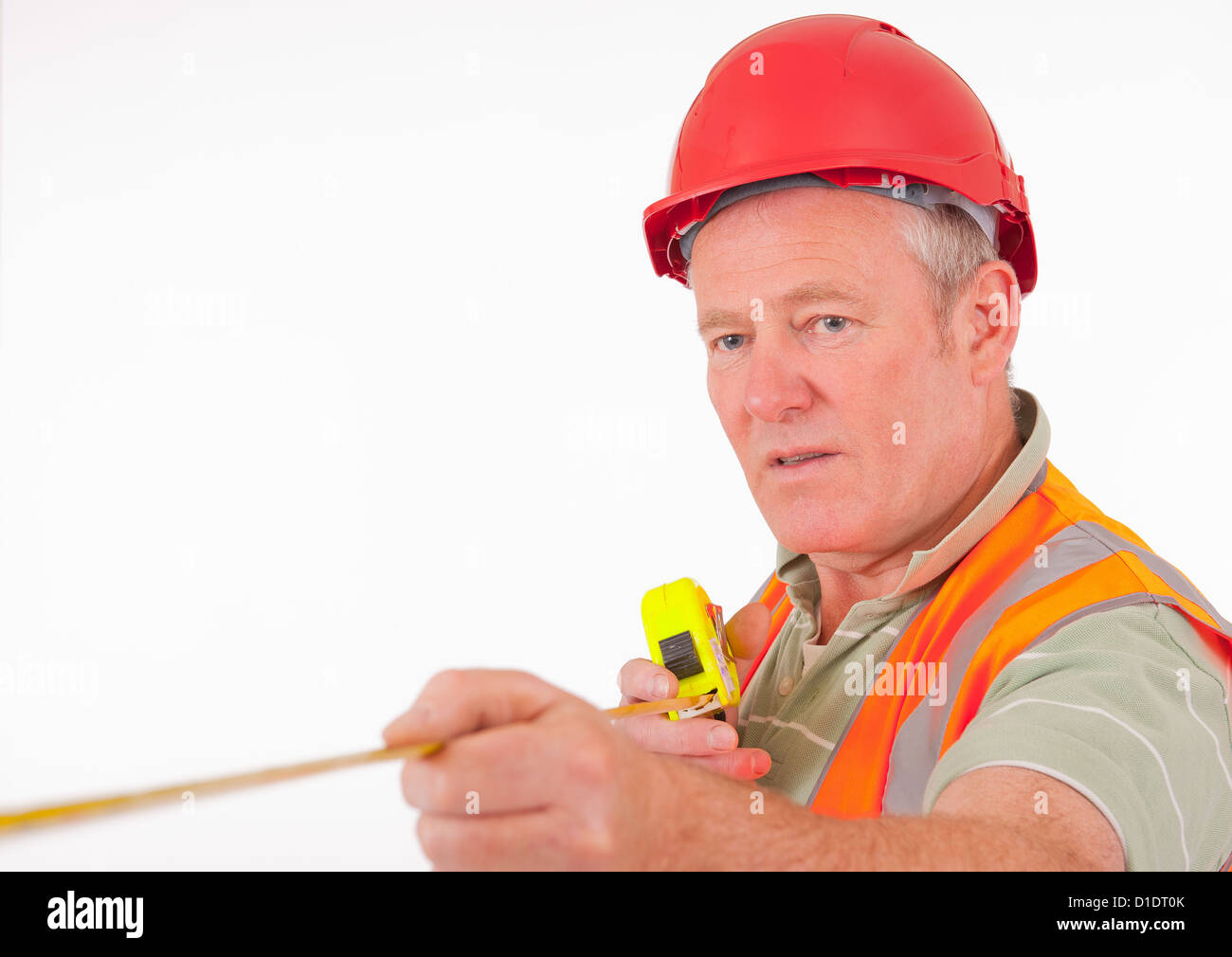 Close up portrait of a construction worker wearing a red hard hat ...