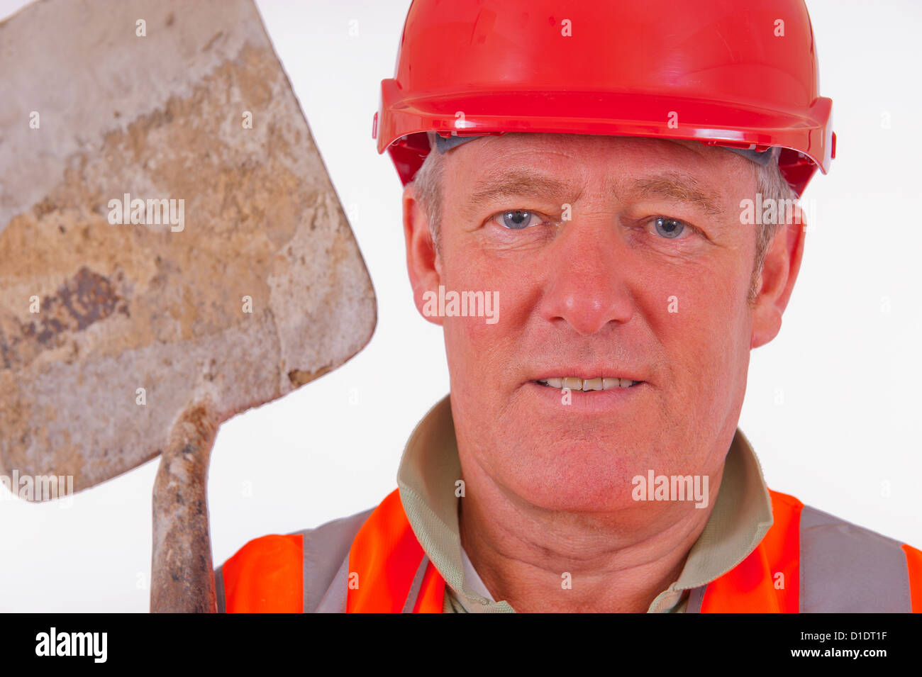Close up portrait of a construction worker wearing a red hard hat ...