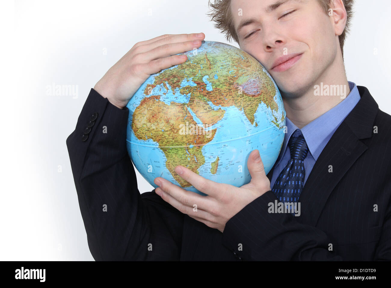 Happy young man hugging globe hi-res stock photography and images - Alamy