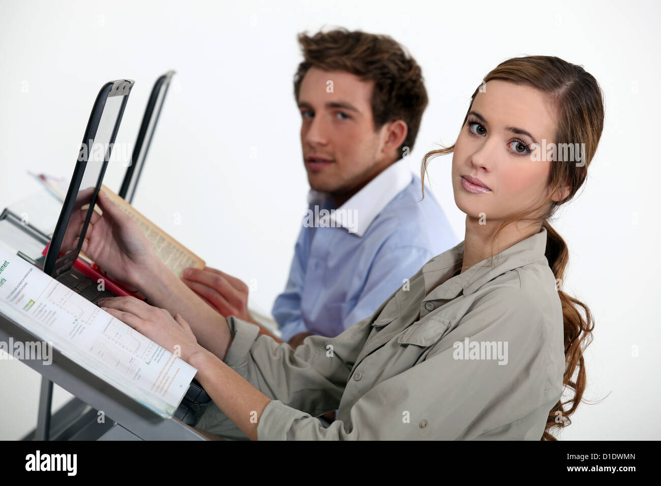 Smart young people using laptop computers Stock Photo - Alamy