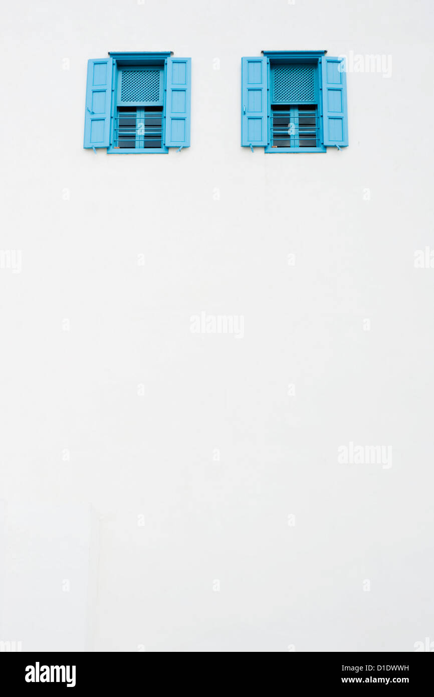 White building with blue shutters hi-res stock photography and images ...