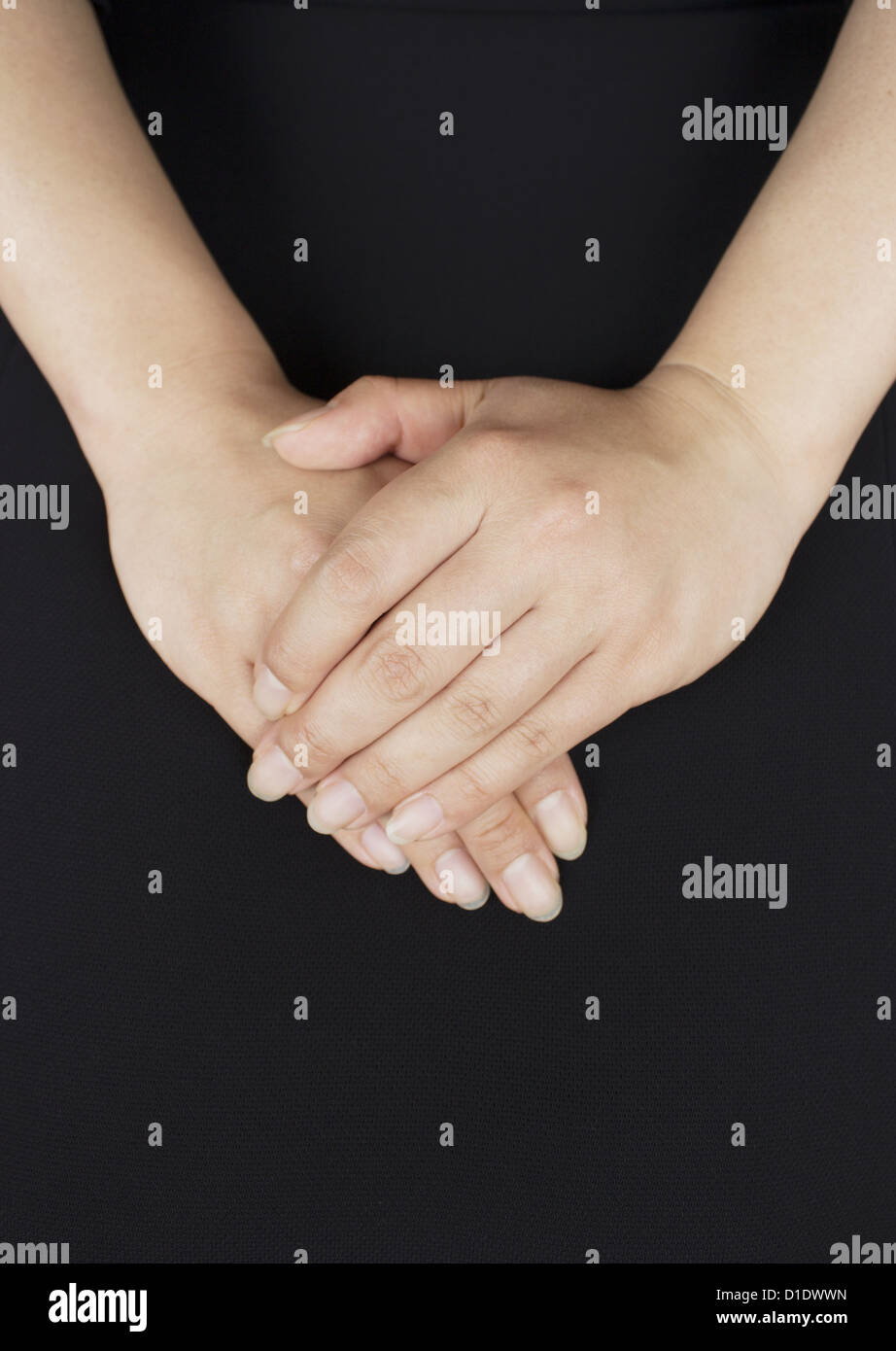 Crossed hands (Mourning image Stock Photo - Alamy