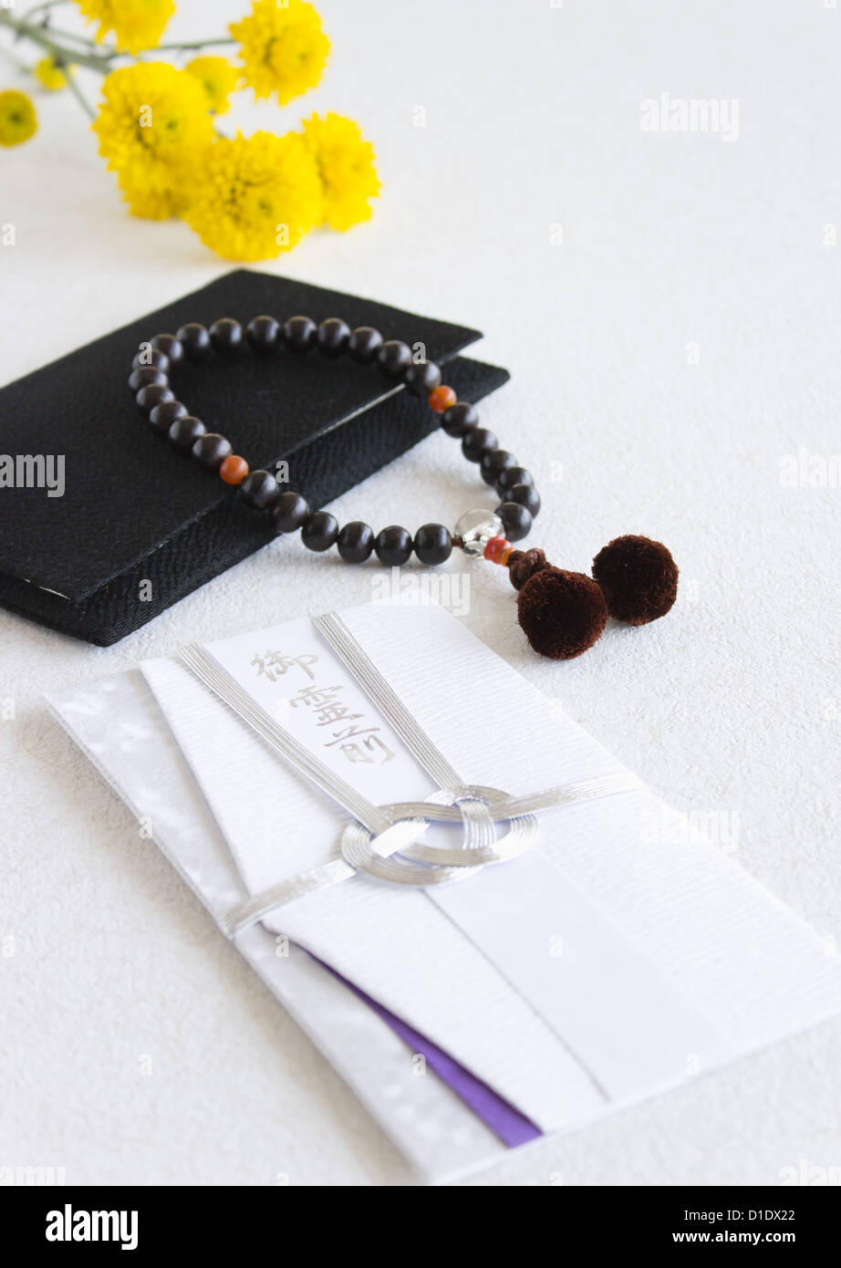 Buddhist rosary and a condolence-money envelope (Mourning image Stock ...