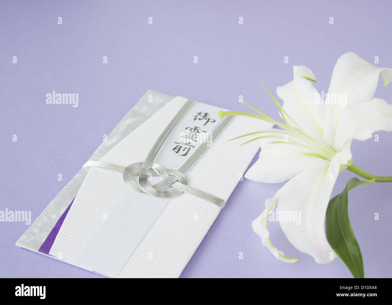 Lily and a condolence-money envelop (Mourning image Stock Photo - Alamy