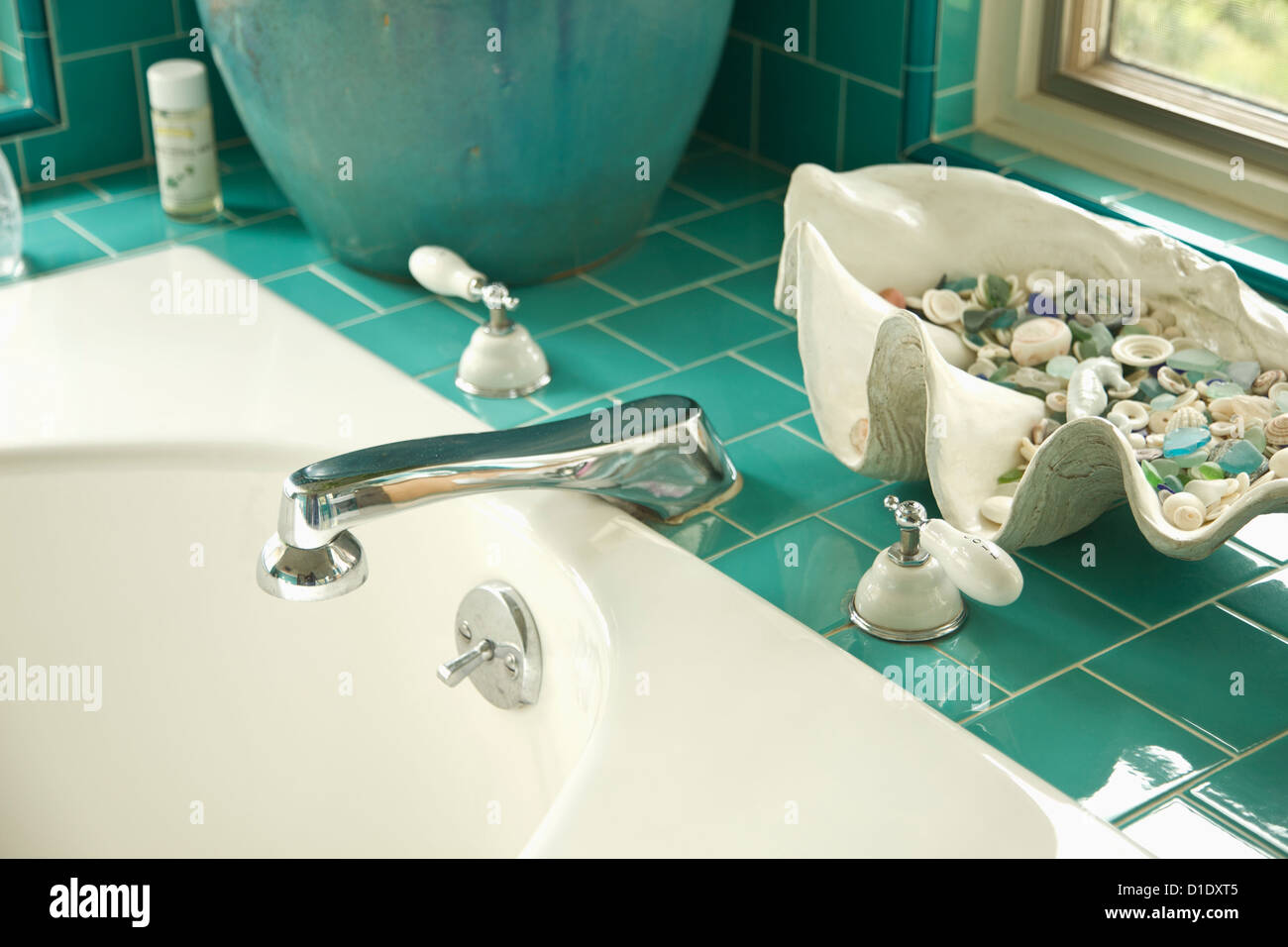 Decorative shells on aqua tile bathroom counter near sink; Carpinteria ...