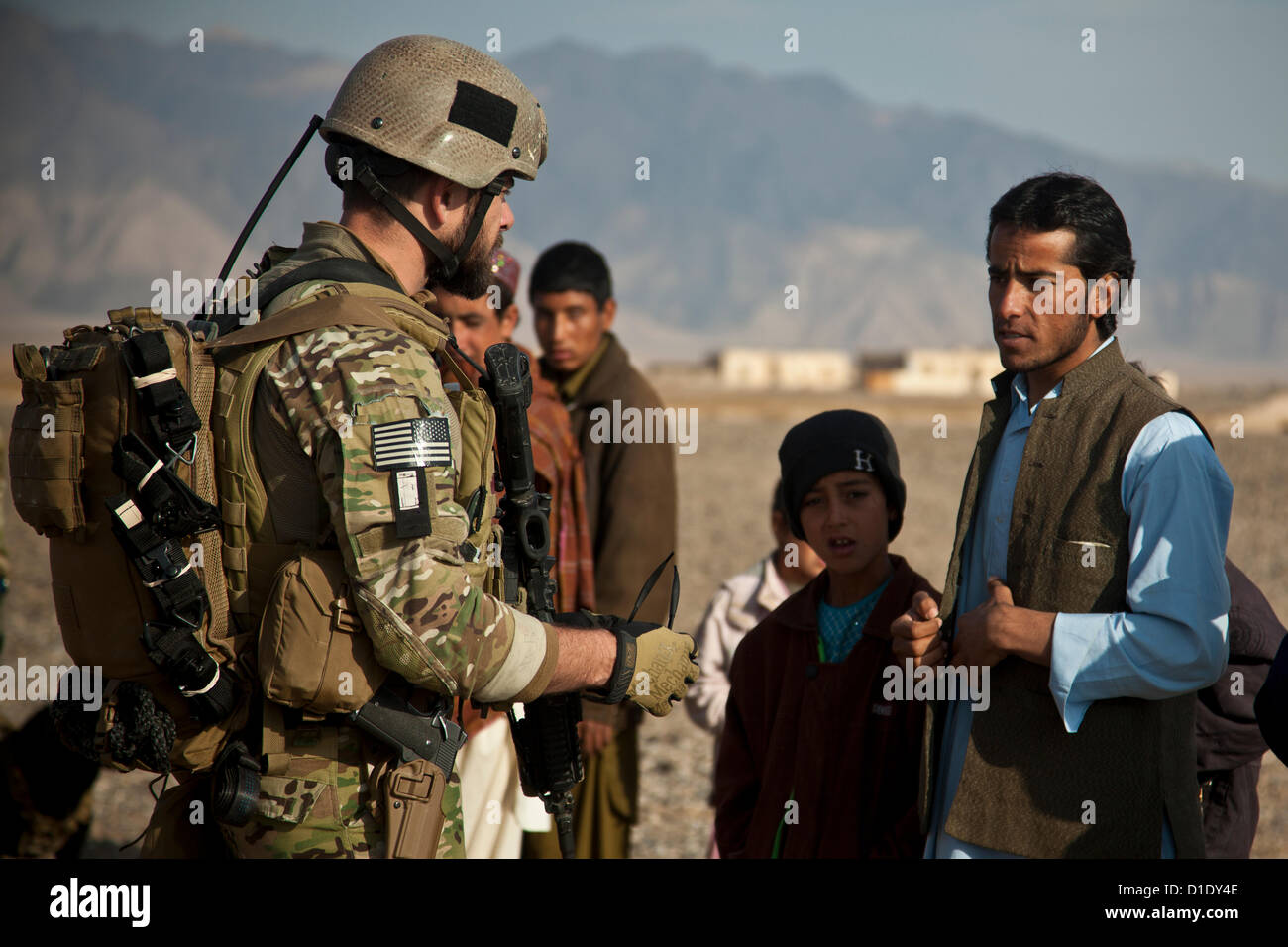 US Special Forces talk with villagers during a patrol December 16, 2012 ...