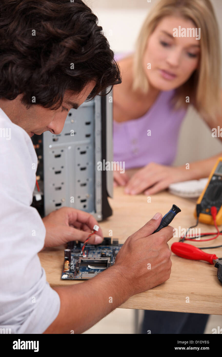 Computer repairing technician Stock Photo - Alamy