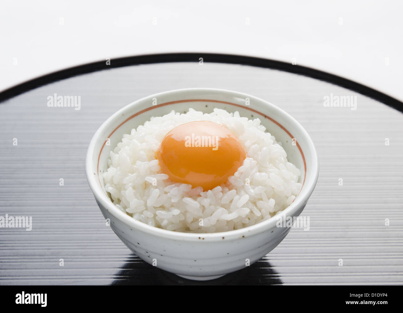 Raw egg sauce over rice Stock Photo - Alamy