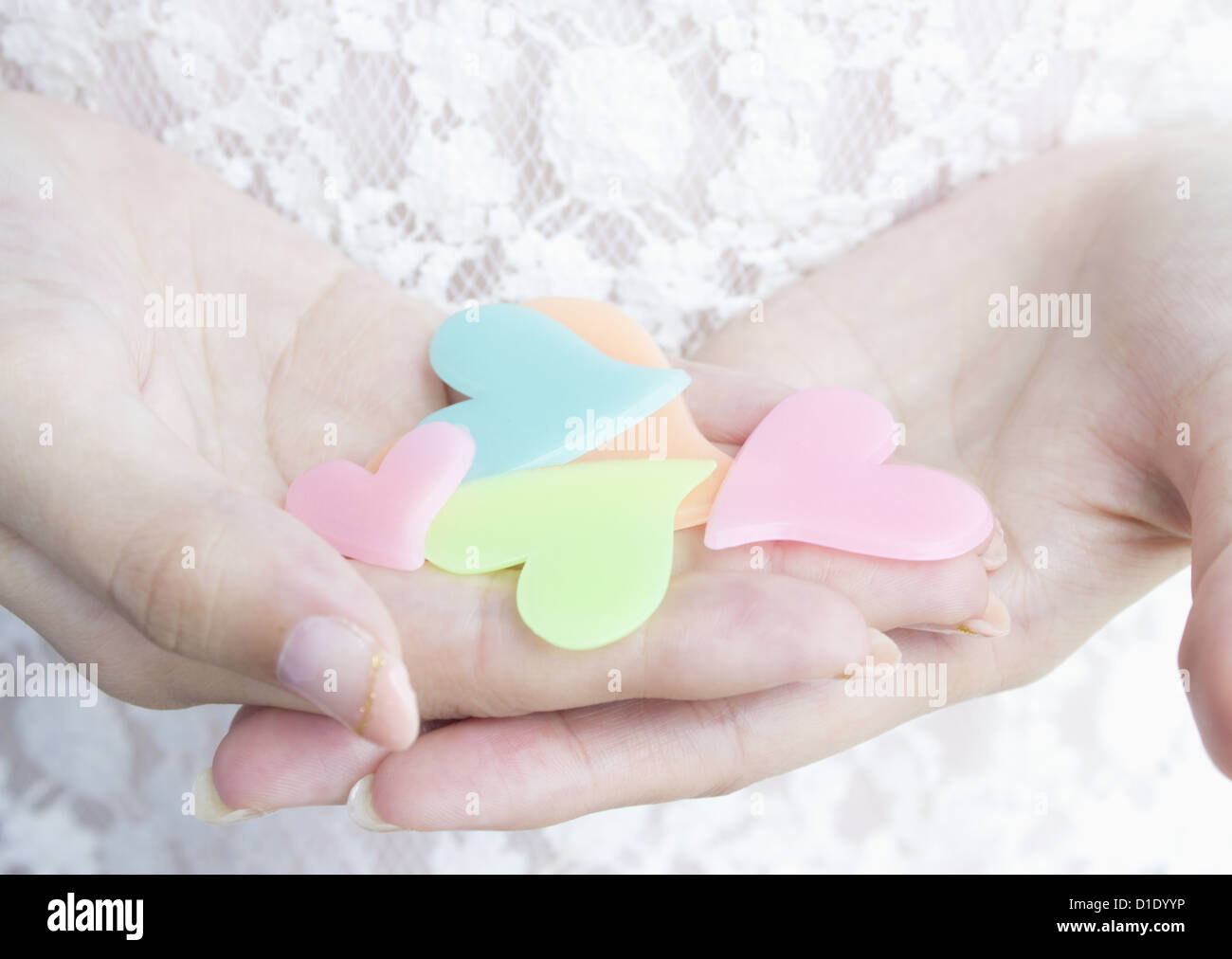 Hand holding hearts Stock Photo - Alamy