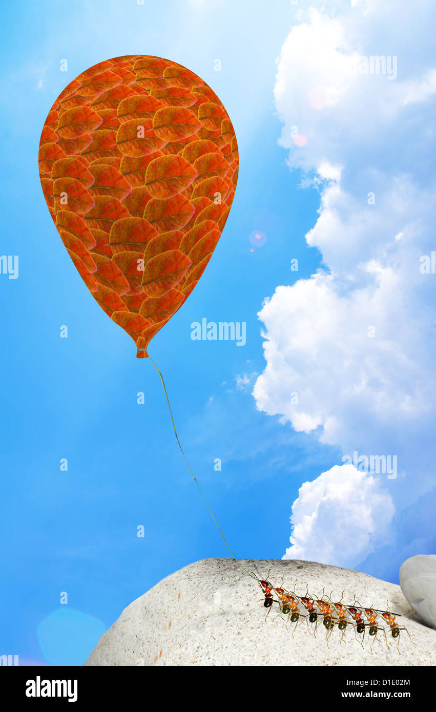 Ants drag to move the huge balloon Stock Photo - Alamy
