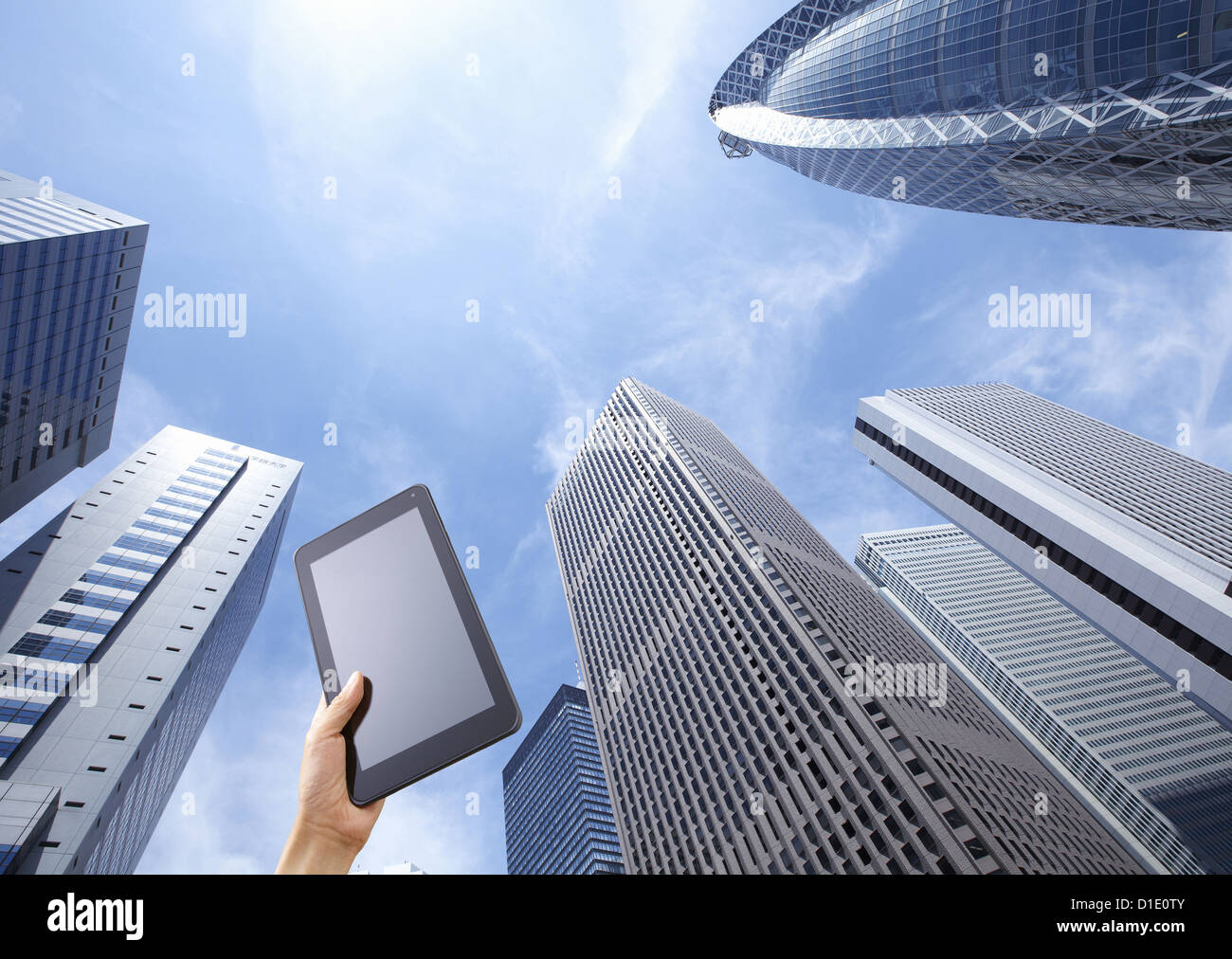 Office buildings and a tablet PC Stock Photo - Alamy