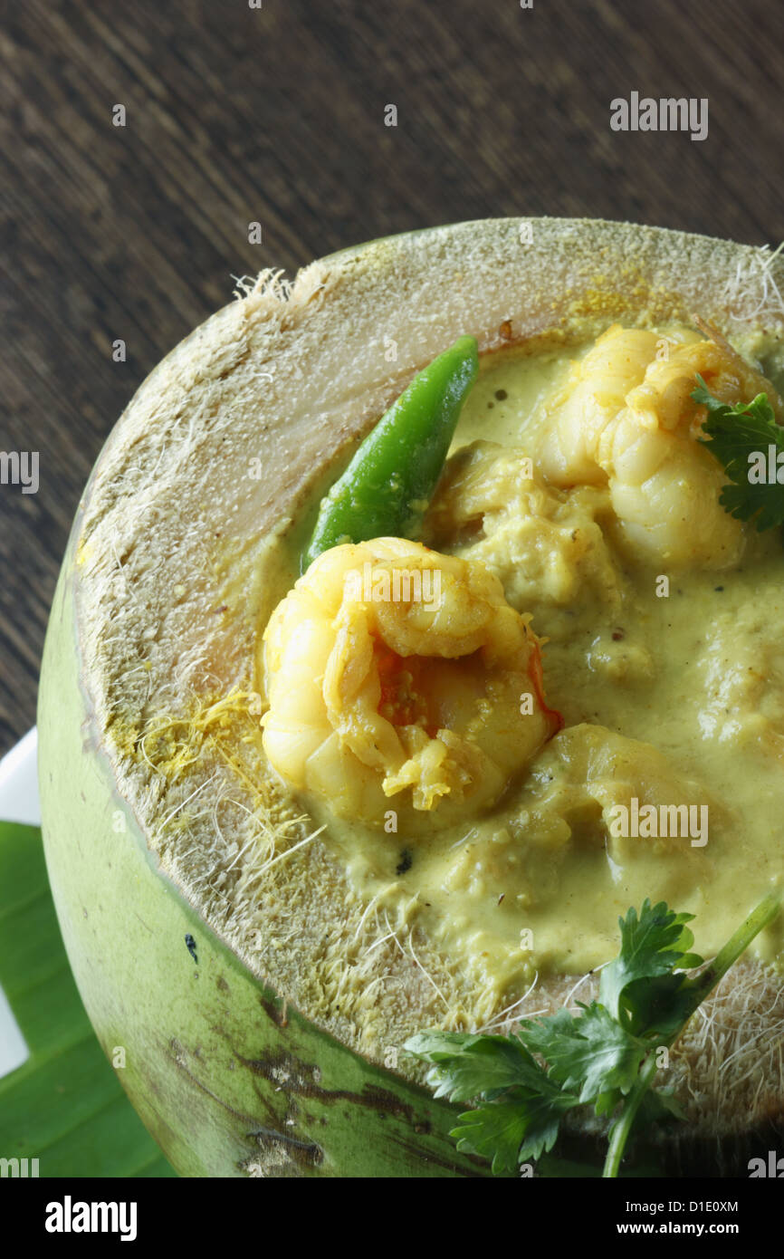 Daab chingri malai curry a bengali dish Stock Photo - Alamy