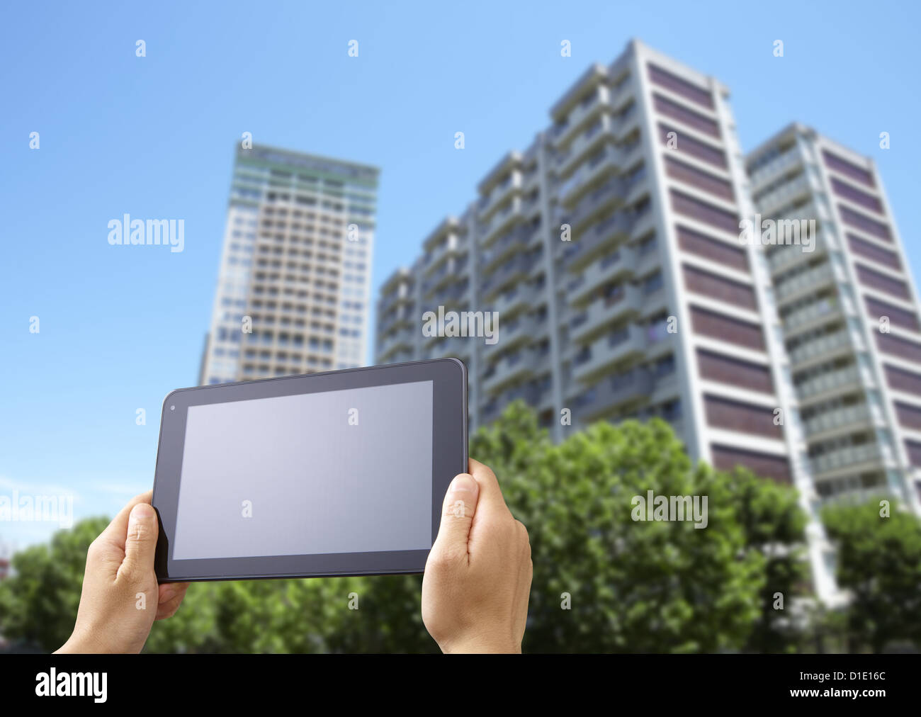 High-rise condominiums and a tablet PC Stock Photo - Alamy