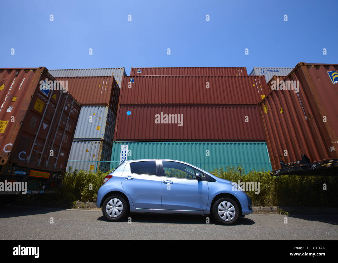 Containers and a car Stock Photo - Alamy