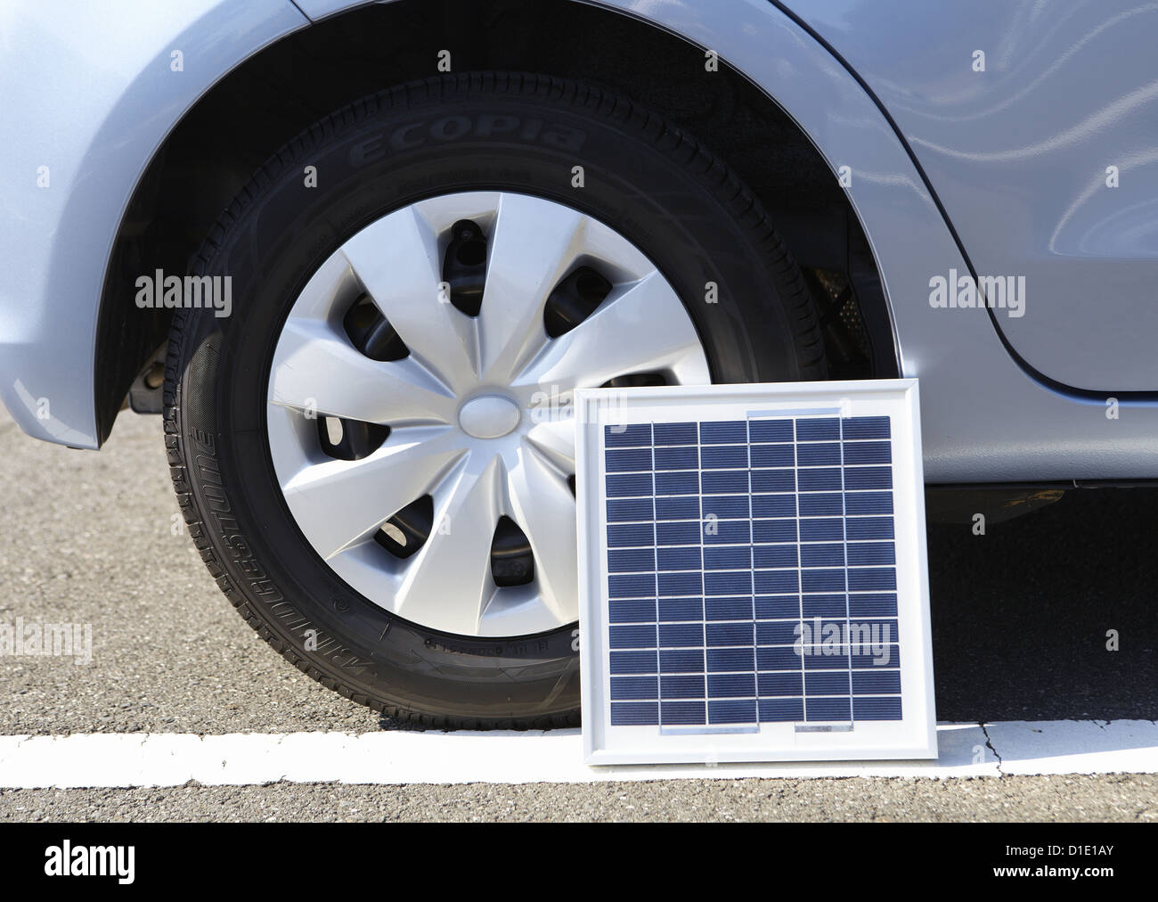 Tire of a car and a solar panel Stock Photo - Alamy