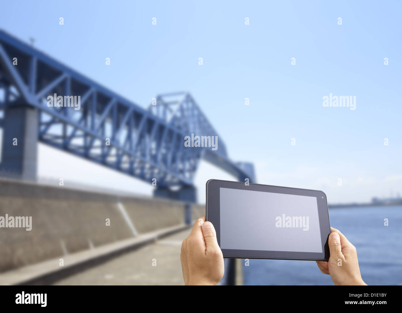 Tokyo Gate Bridge and a tablet PC Stock Photo - Alamy
