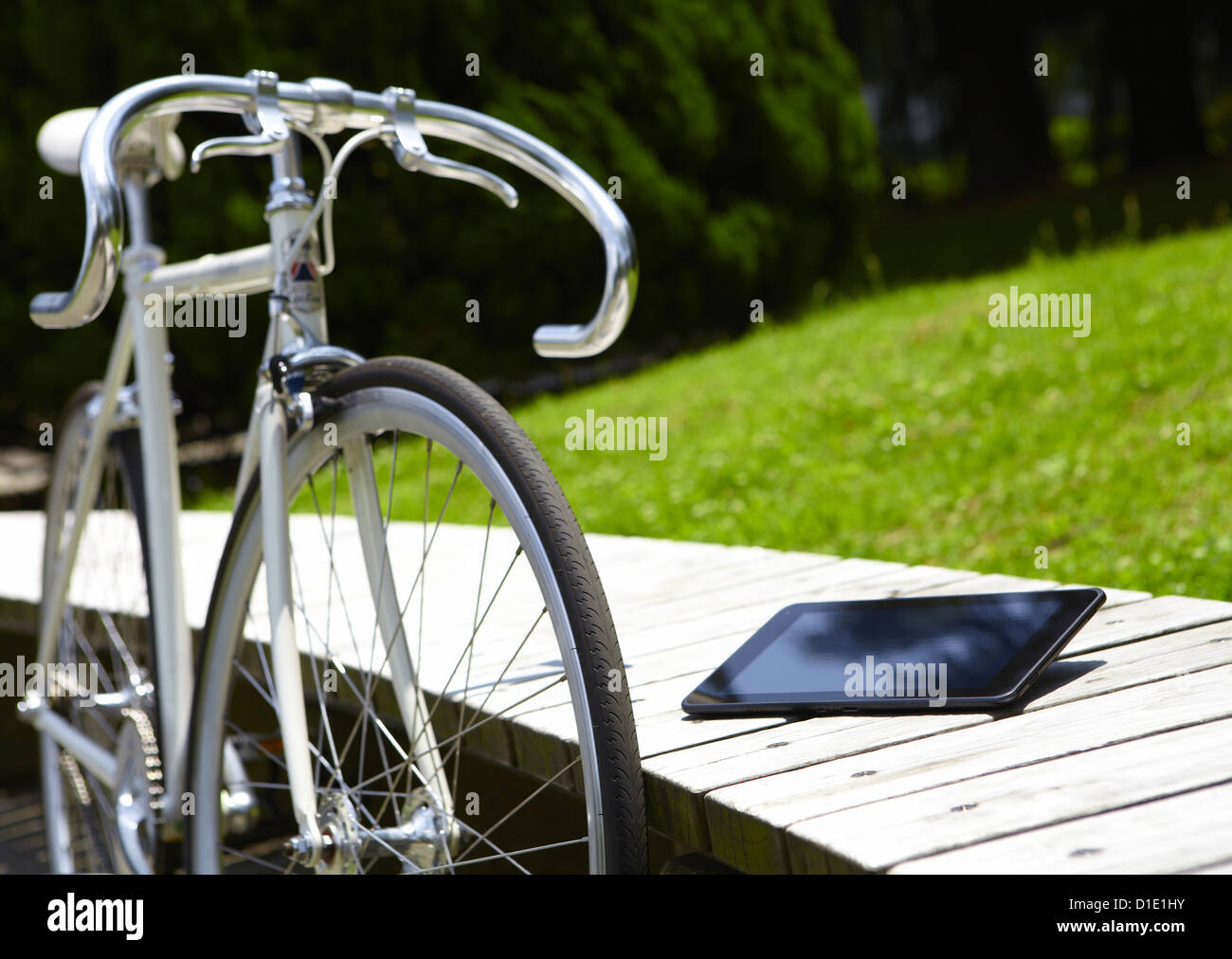 Bicycle and a tablet PC Stock Photo - Alamy